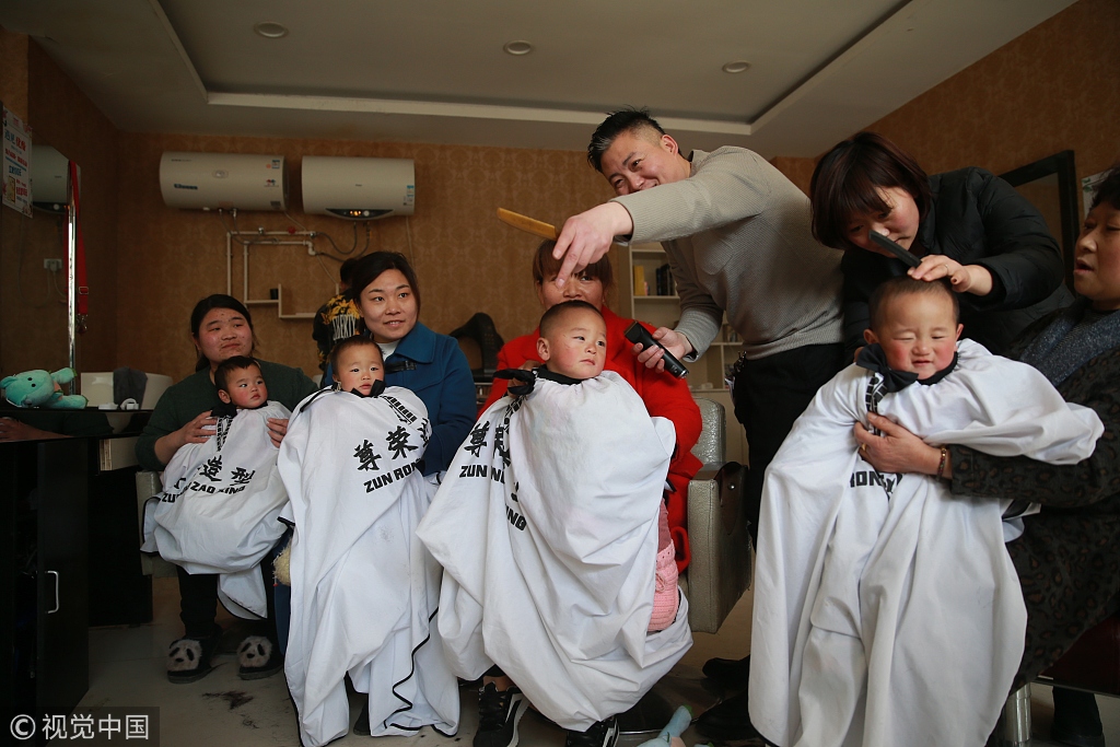 Kids get haircuts to celebrate the traditional arrival of spring ...