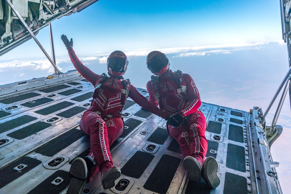 Skydiver uses friend as human surfboard in skydiving - China Plus